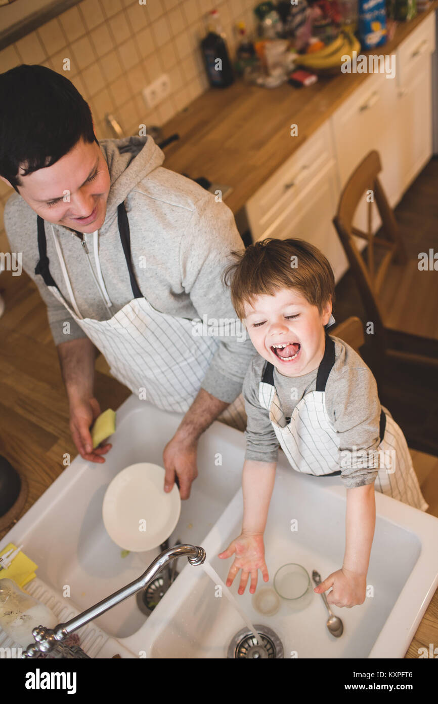 Man washing up housework hi-res stock photography and images - Alamy