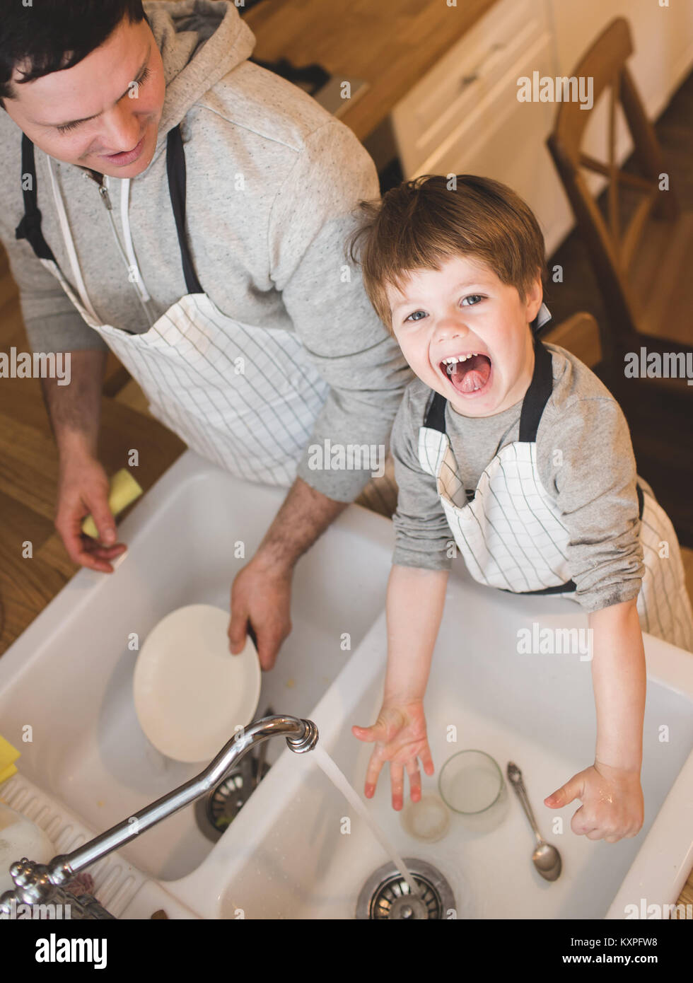 Man washing up housework hi-res stock photography and images - Alamy