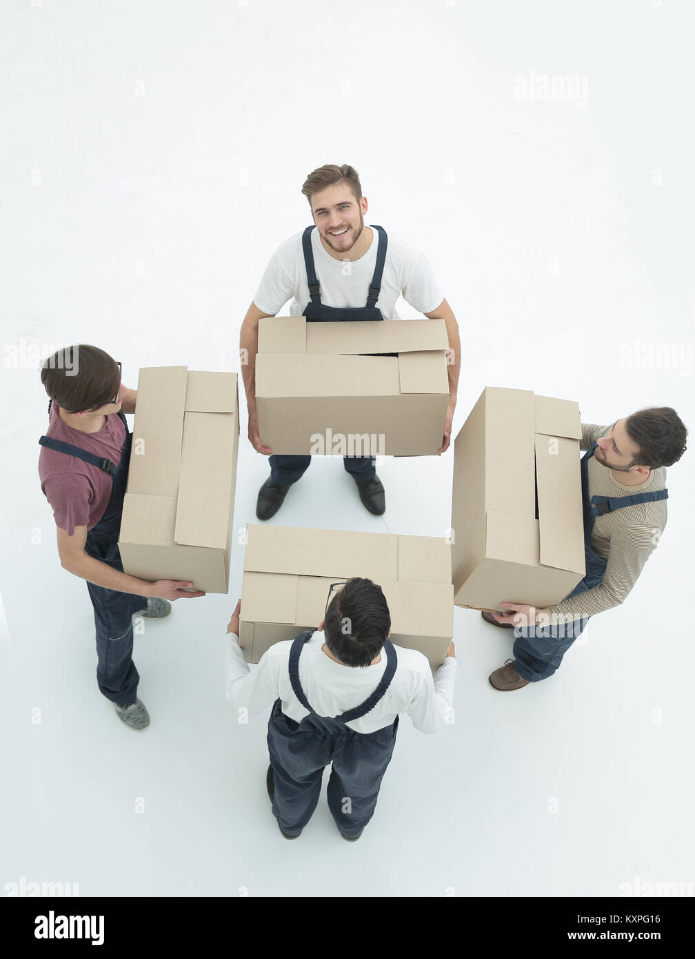 Delivery men with cardboard boxes on white background Stock Photo - Alamy