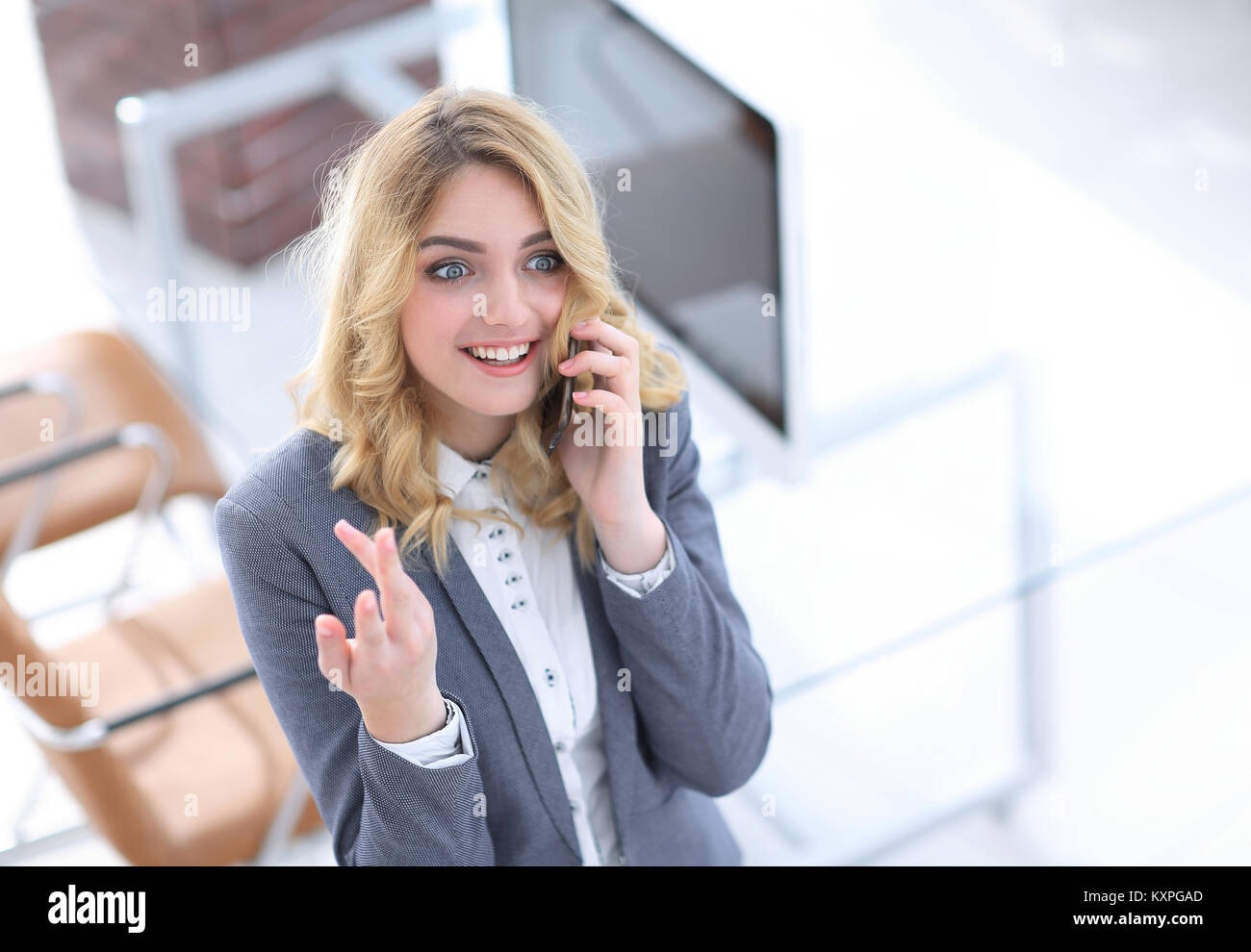 happy employee is talking on the smartphone Stock Photo - Alamy