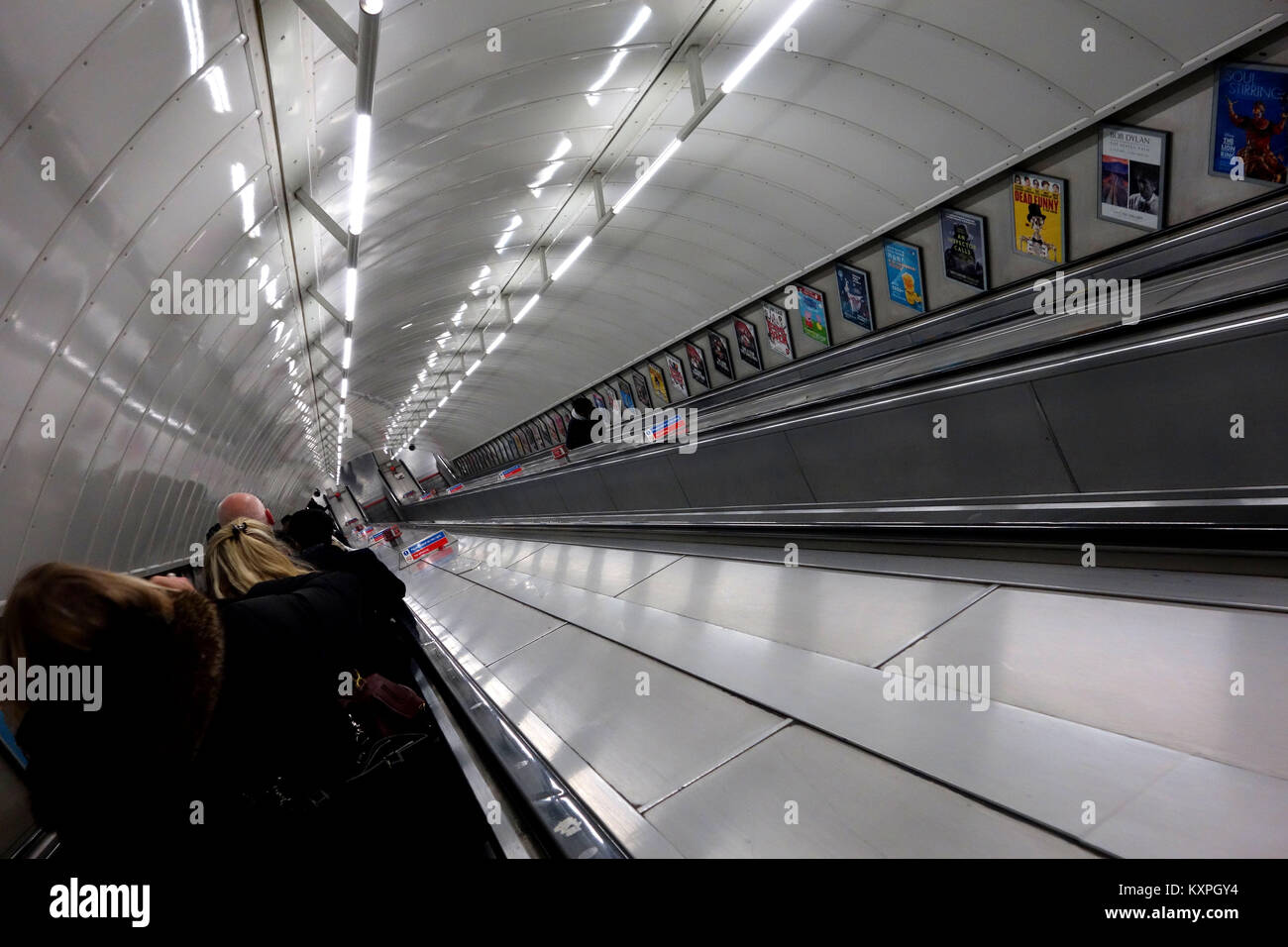 Going down escalator underground tube hi-res stock photography and ...