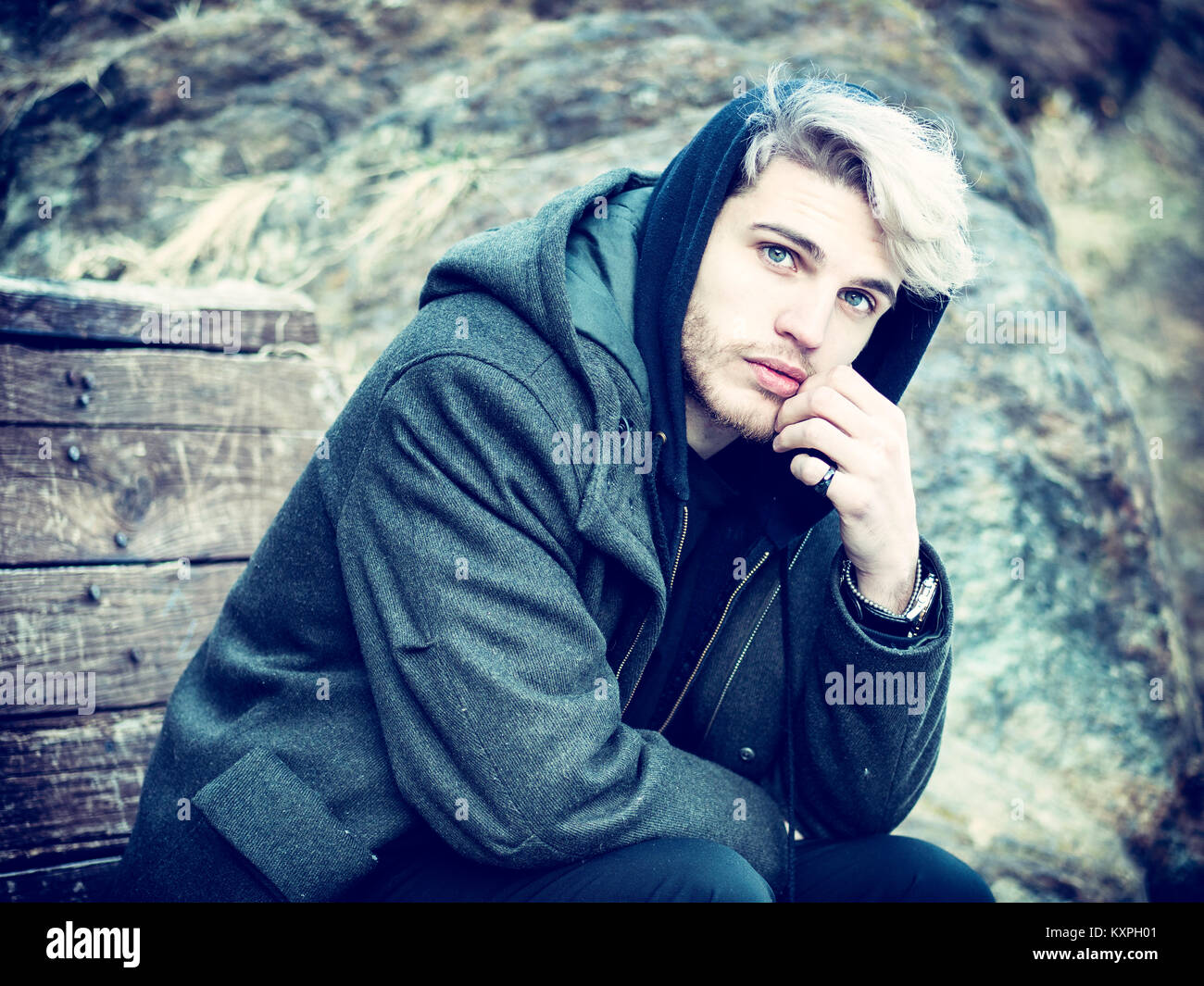 Handsome man in snow posing for camera Stock Photo - Alamy