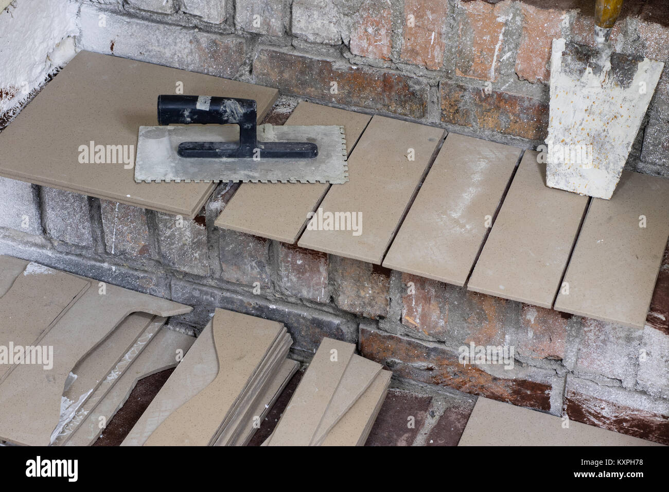 A workplace for a master from laying tiles. Tools and accessories as ...