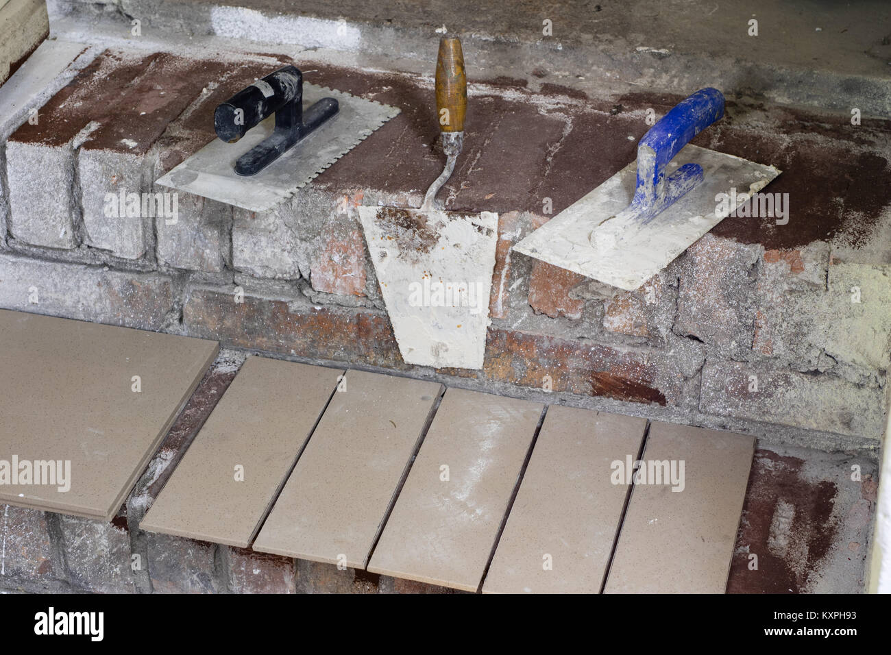 A workplace for a master from laying tiles. Tools and accessories as ...