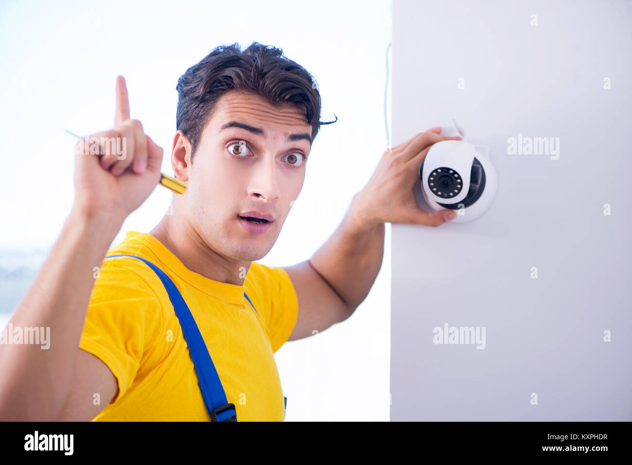 Technician repairing cctv camera in hi-res stock photography and images ...