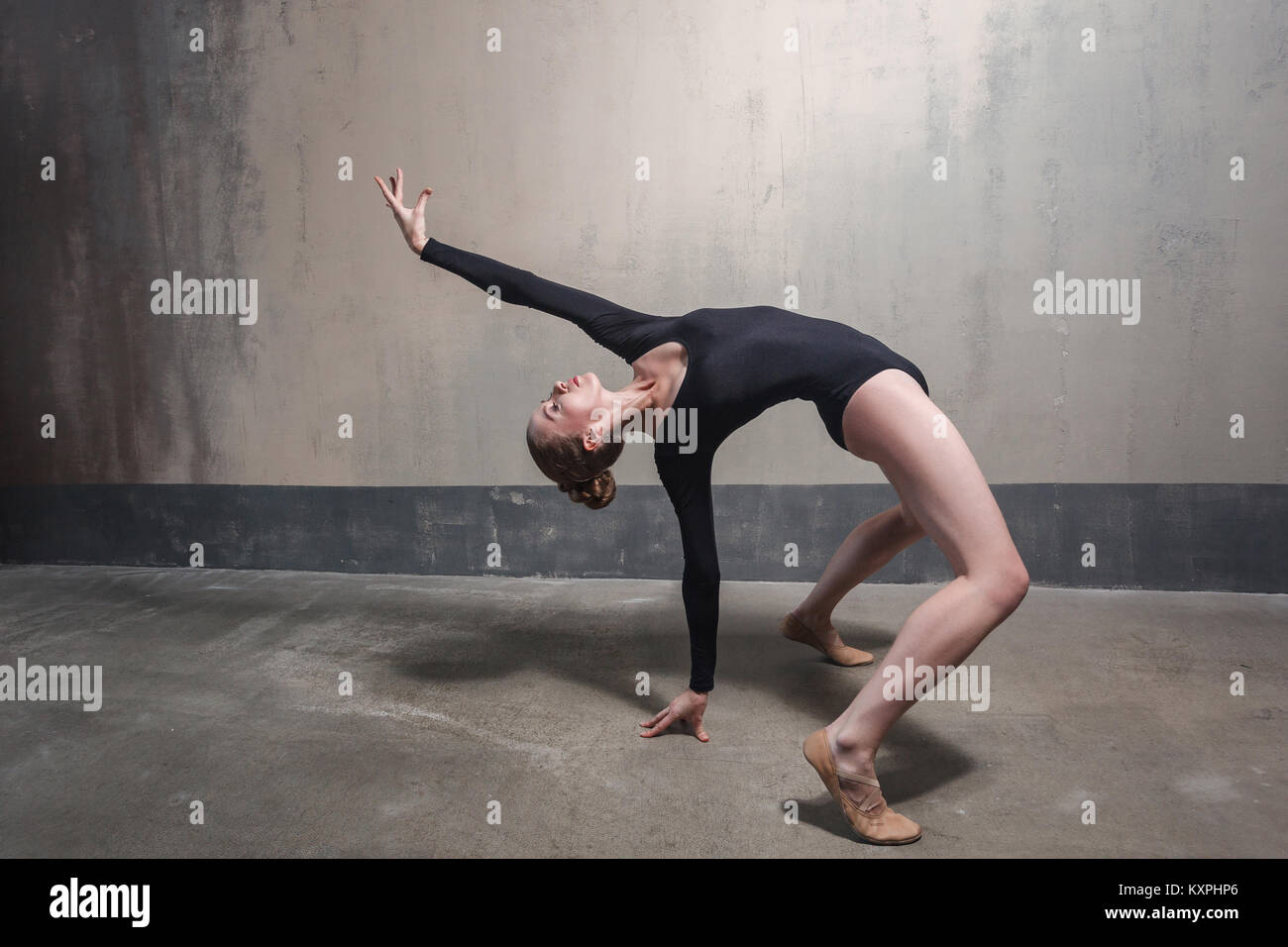 Professional dancer doing bridge posture. Studio shot Stock Photo - Alamy