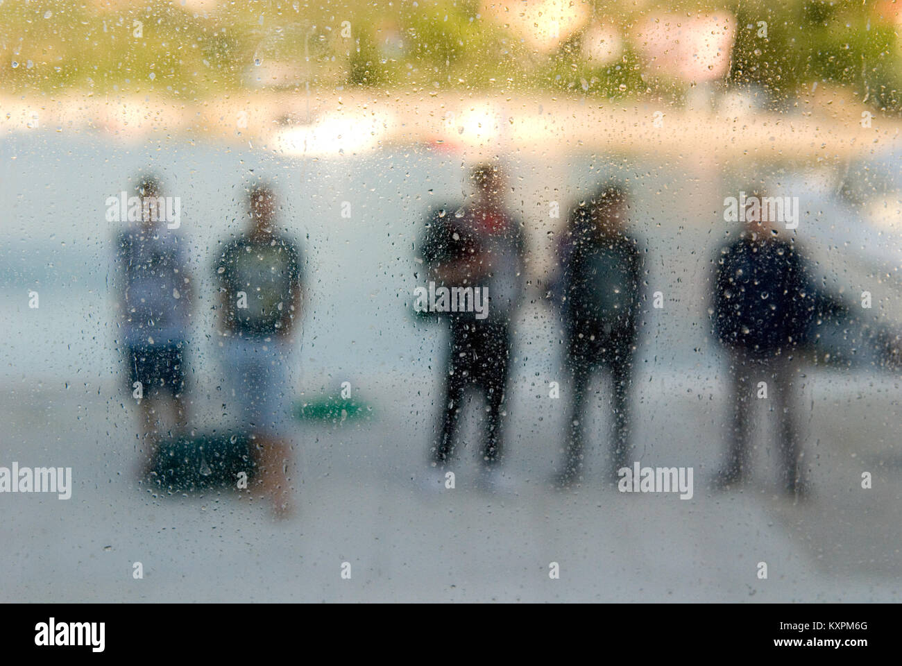 looking through a window covered in water droplets and condensation at ...