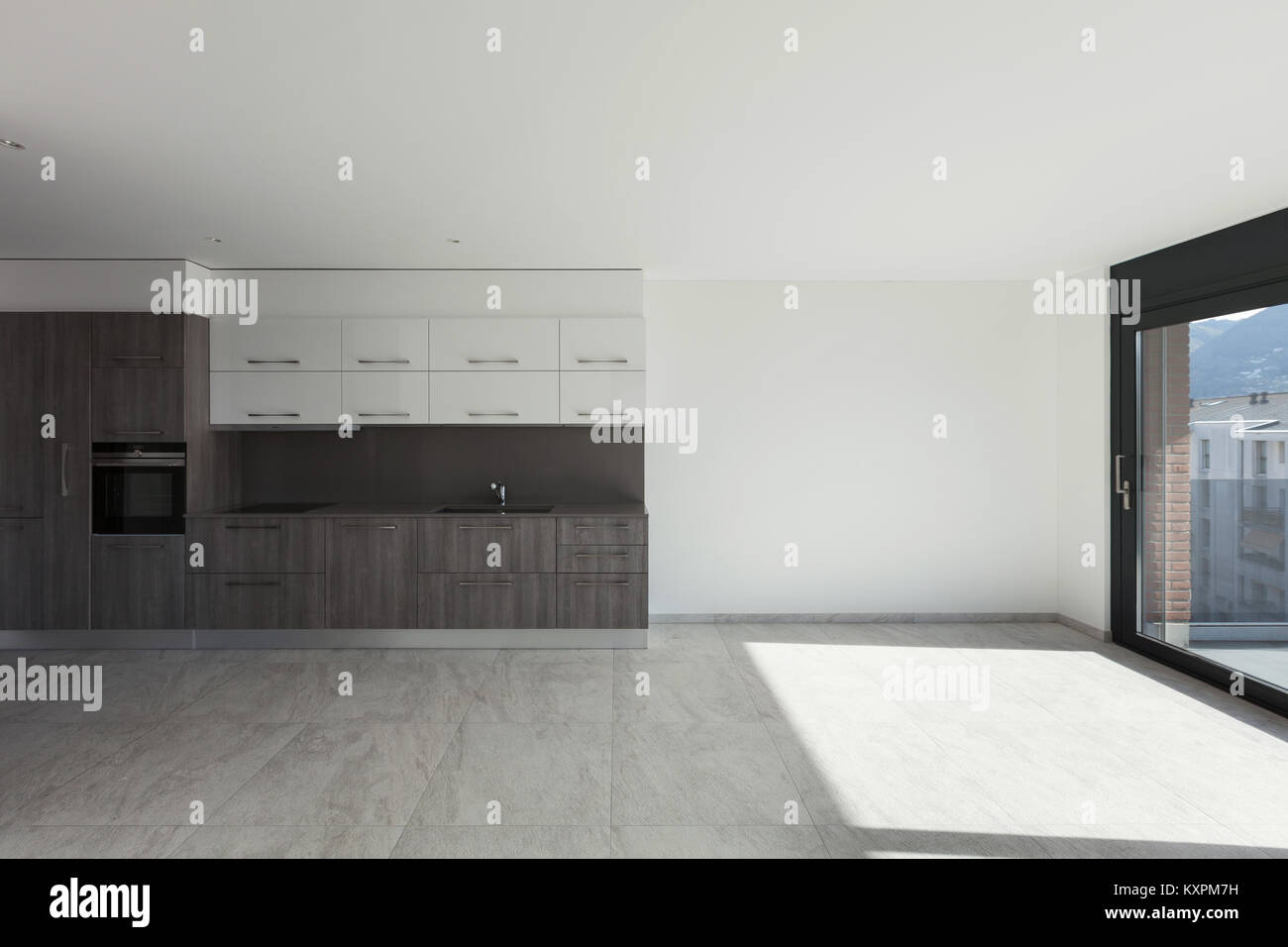 Interior of empty apartment, wide room with kitchen, tiled floor Stock ...