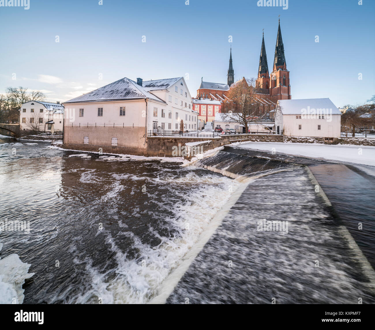 Old mill at Kvarnfallet in the Fyris river with the Cathedral ...