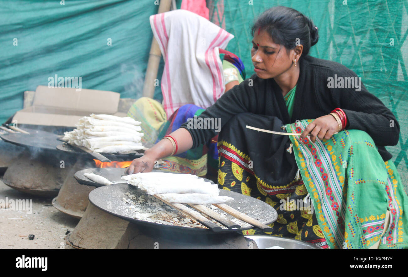 Assamese women preparingTraditional Assamese cake ( Bora Pitha) ahead ...
