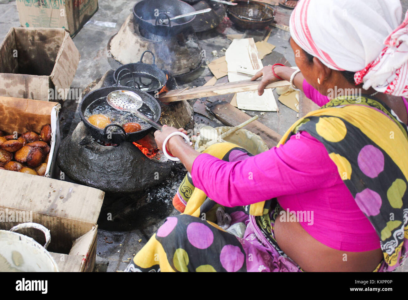 Assamese women preparingTraditional Assamese cake ( Bora Pitha) ahead ...