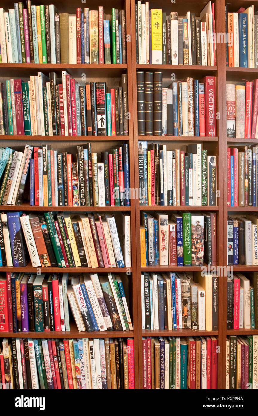 Books in a row on shelves; Bücher aufgereiht in einem Regal Stock Photo ...