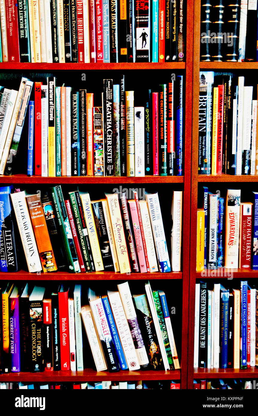 Books in a row on shelves; Bücher aufgereiht in einem Regal Stock Photo ...