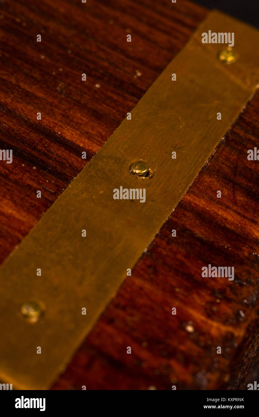 dark weathered teak wood with copper details, close up Stock Photo - Alamy