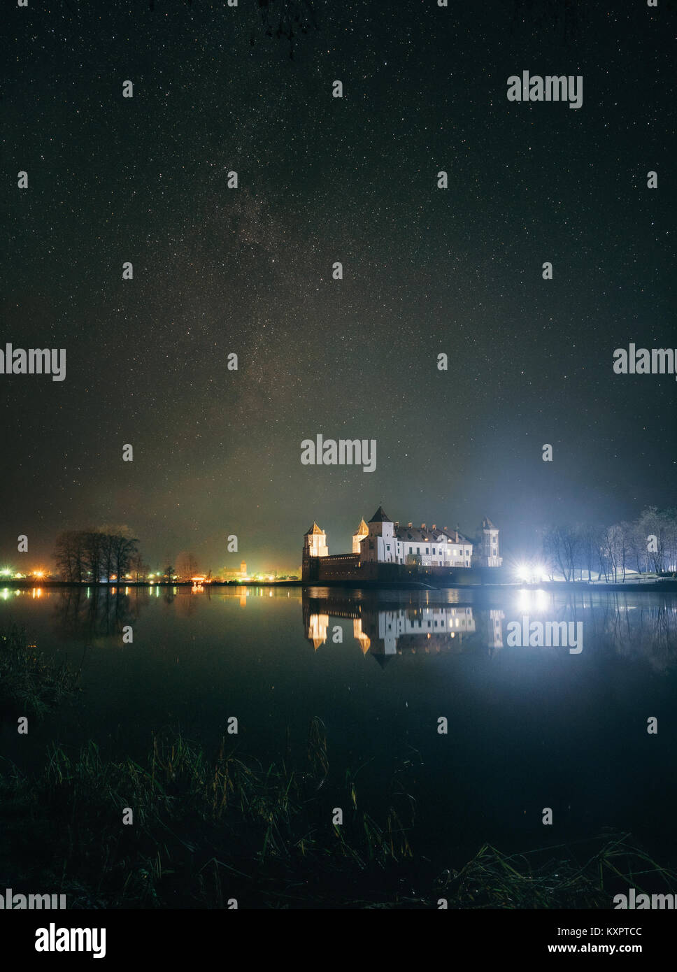 Scenic view of Mir Castle Complex in night with starry sky and glow ...