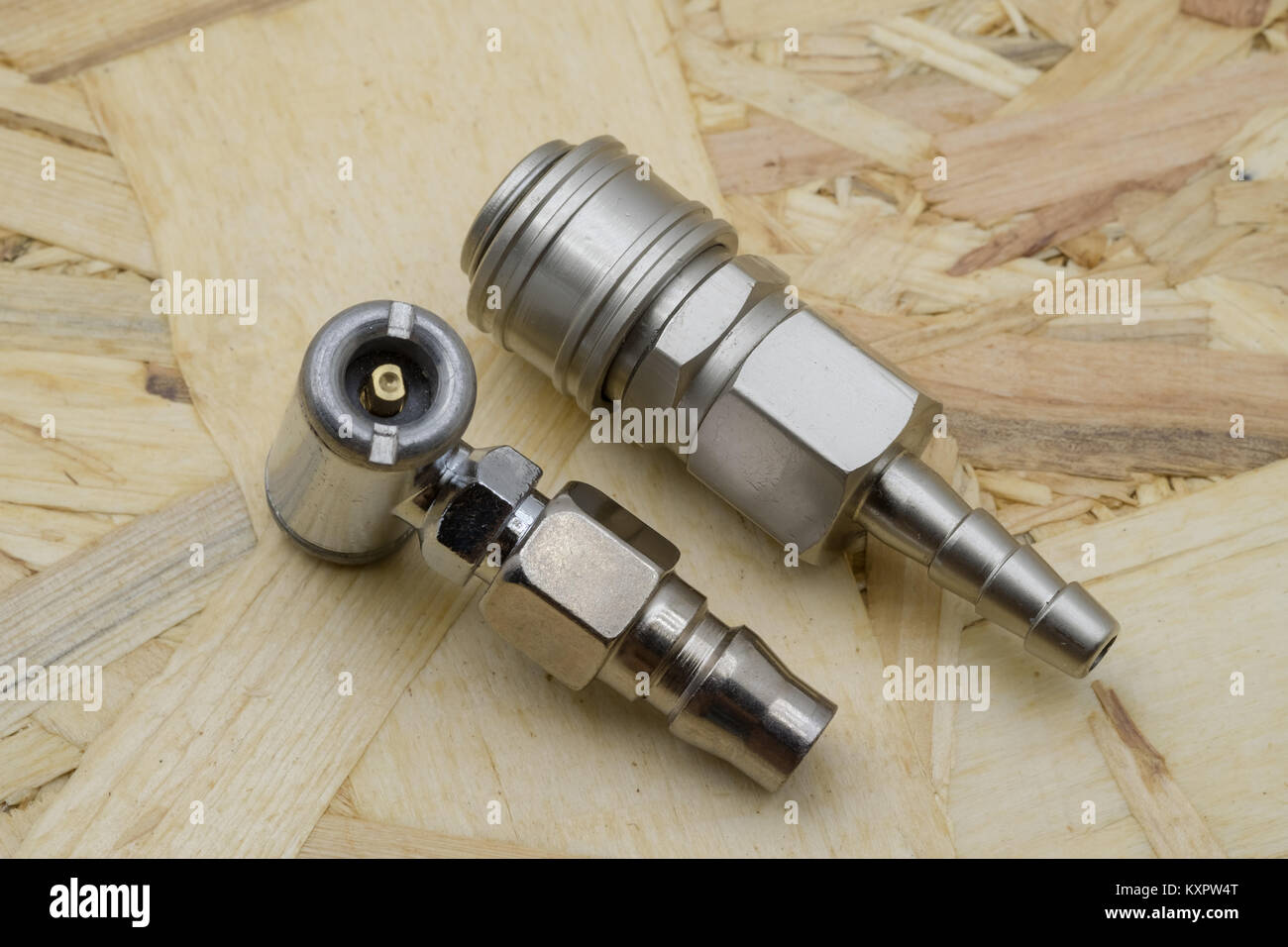 Air coupling connector, Pneumatic fitting on wood background Stock ...