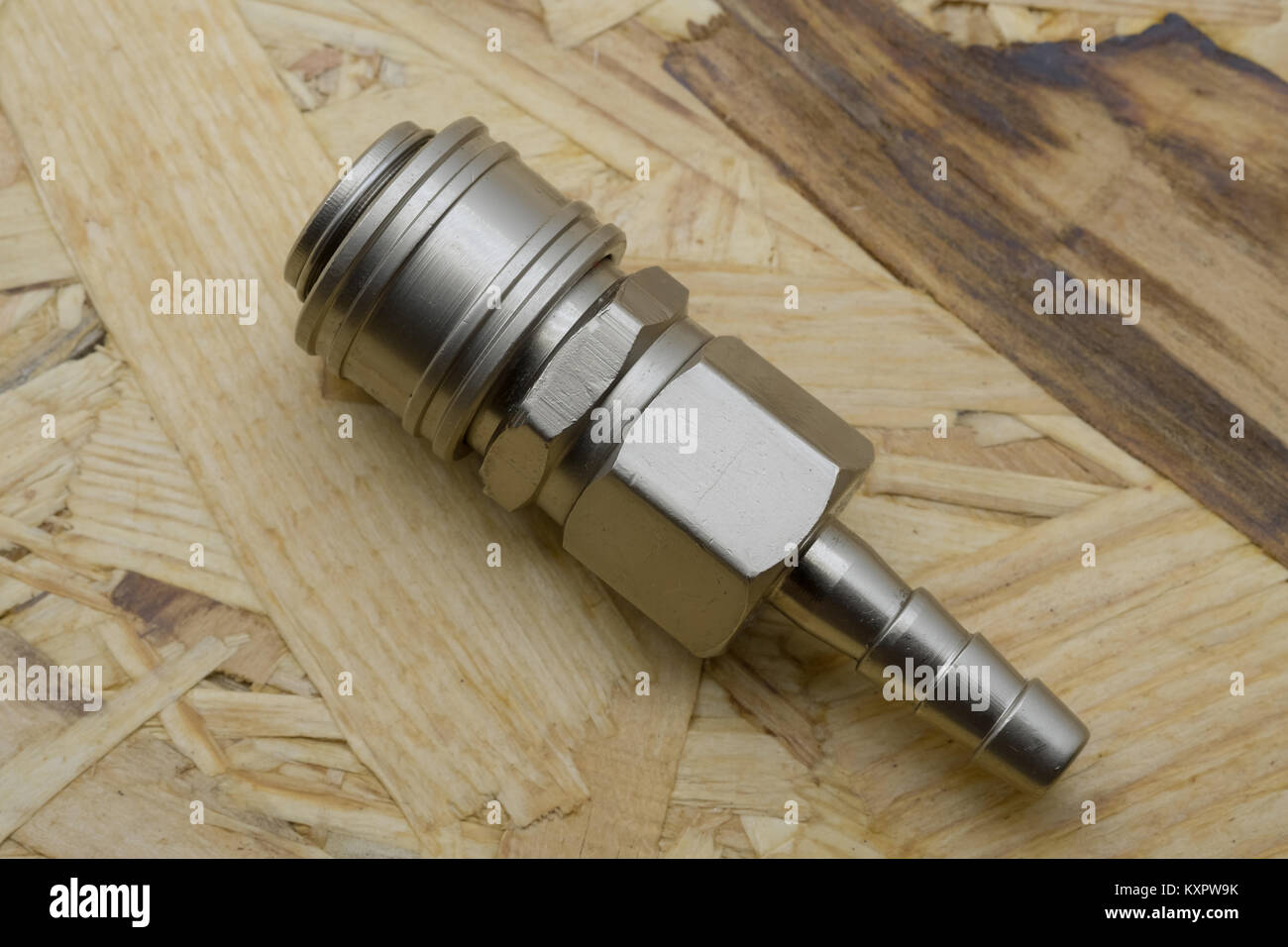Air coupling connector, Pneumatic fitting on wood background Stock ...