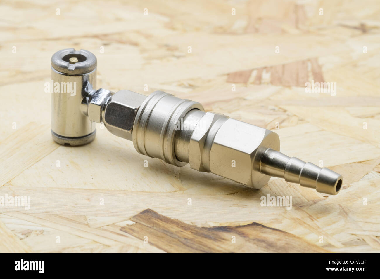 Air coupling connector, Pneumatic fitting on wood background Stock ...