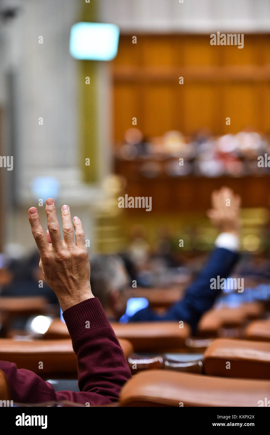Hand of a man raised in the air during a voting procedure Stock Photo ...
