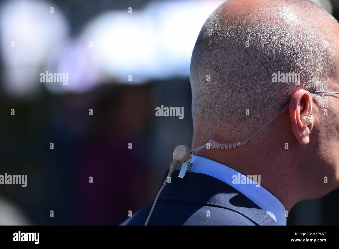 Detail with in ear headphone during a live broadcast by a reporter ...