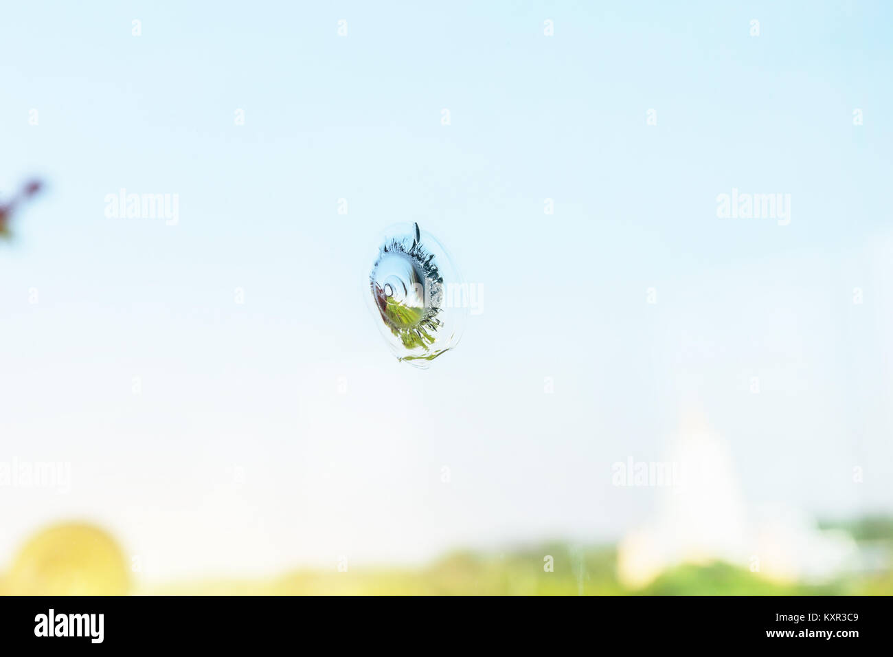 broken glass windows with small hole Stock Photo - Alamy