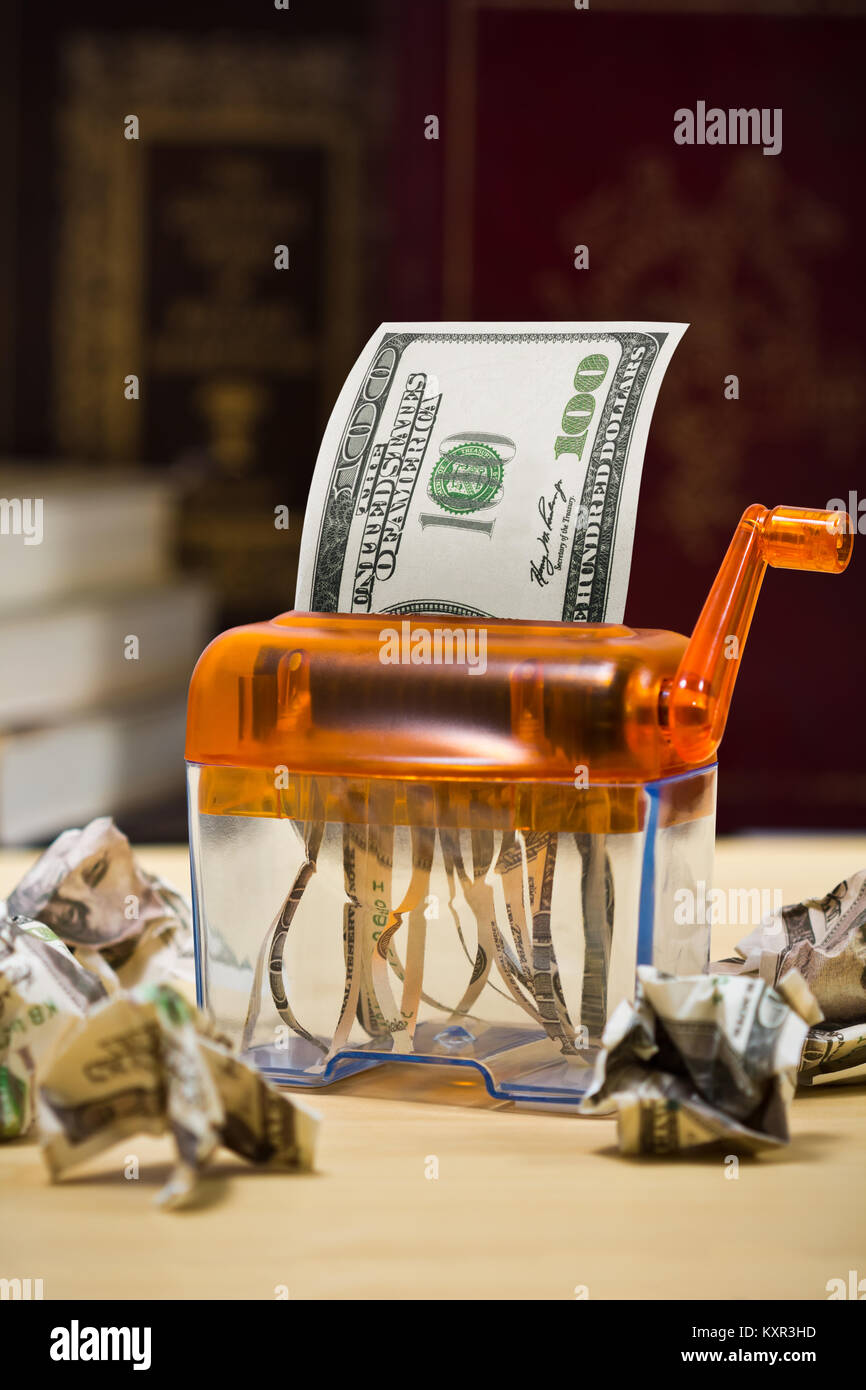 Dollar banknote in a paper shredder Stock Photo - Alamy