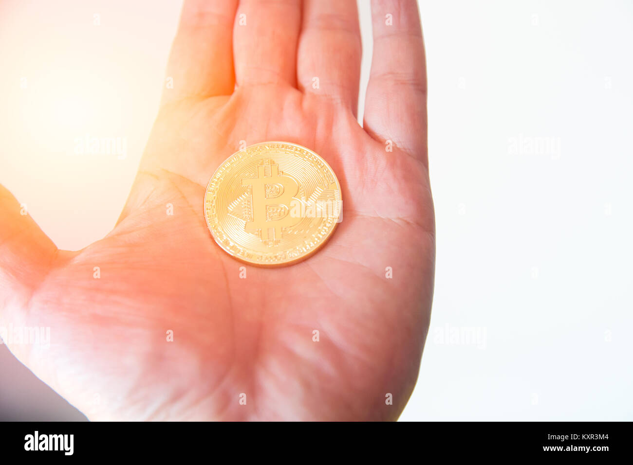 Bitcoin cryptocurrency in hand hi-res stock photography and images - Alamy