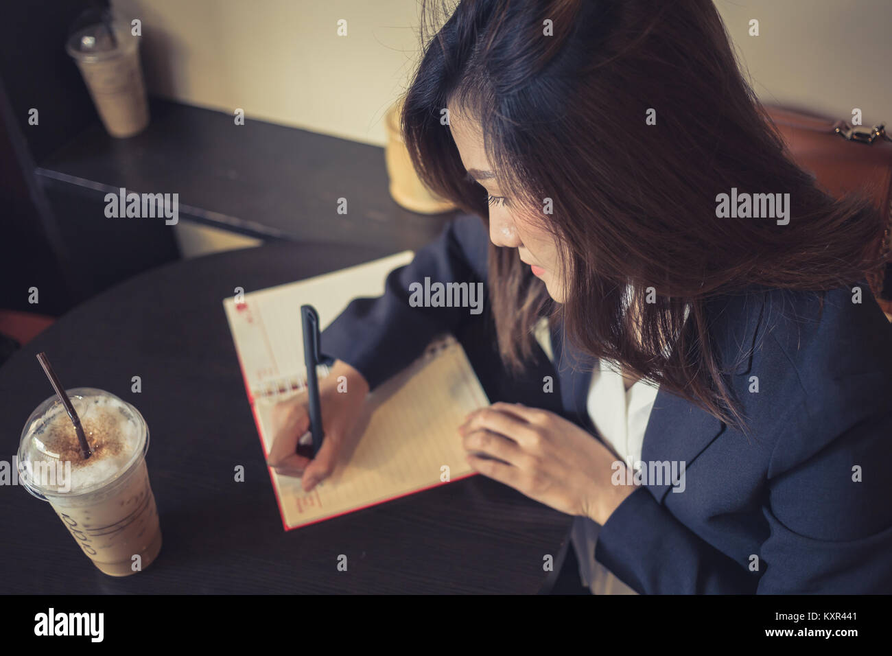 business women working writing in the cafe Stock Photo - Alamy