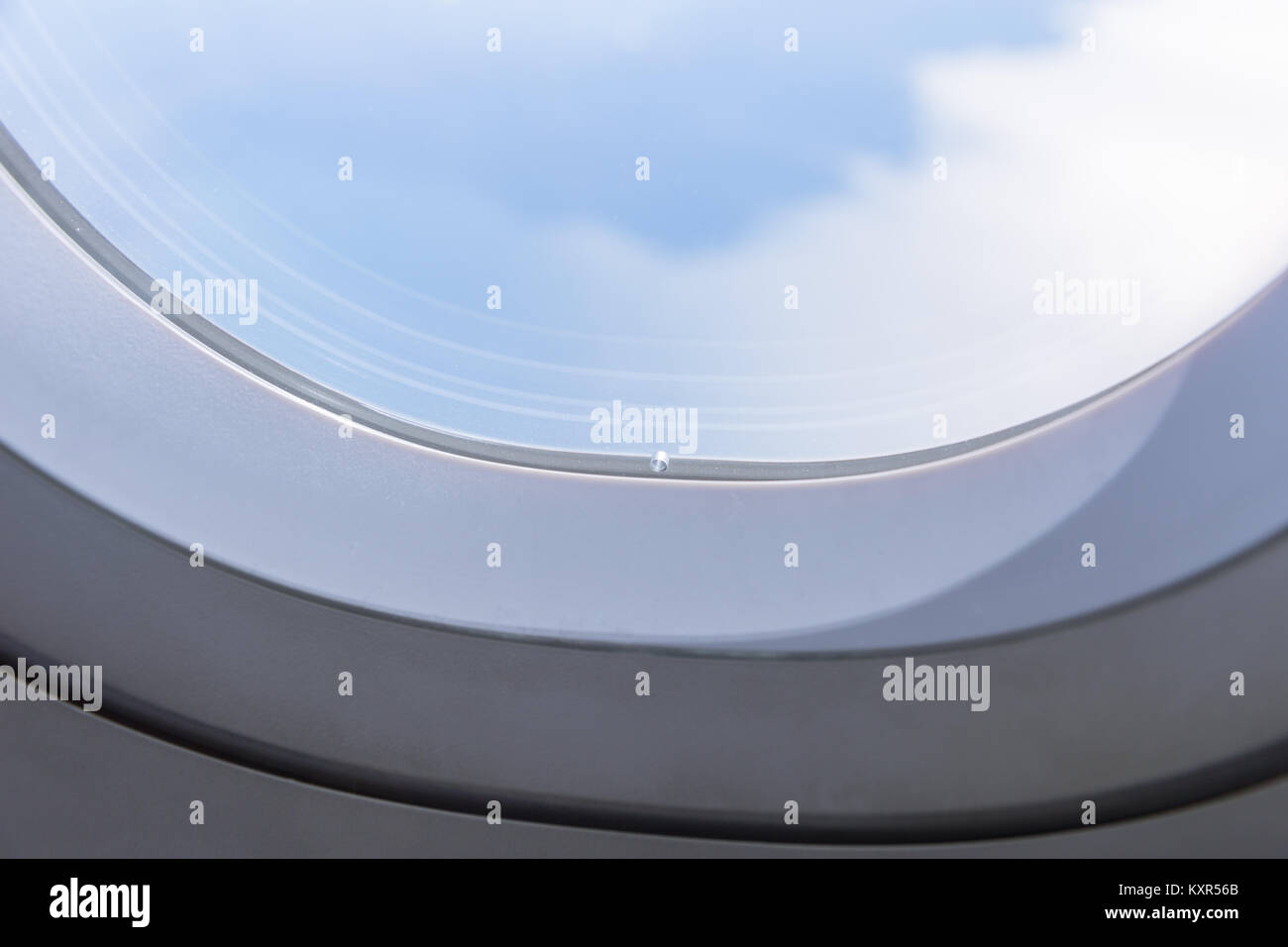 Bleed holes Tiny small hole in Airplane Windows Stock Photo - Alamy
