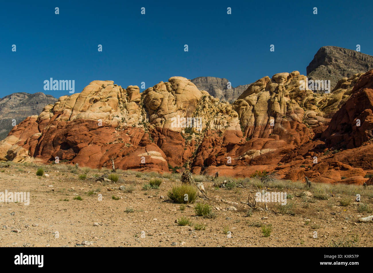 Layers of different colored sandstone on a rocky cliff in Red Rock ...
