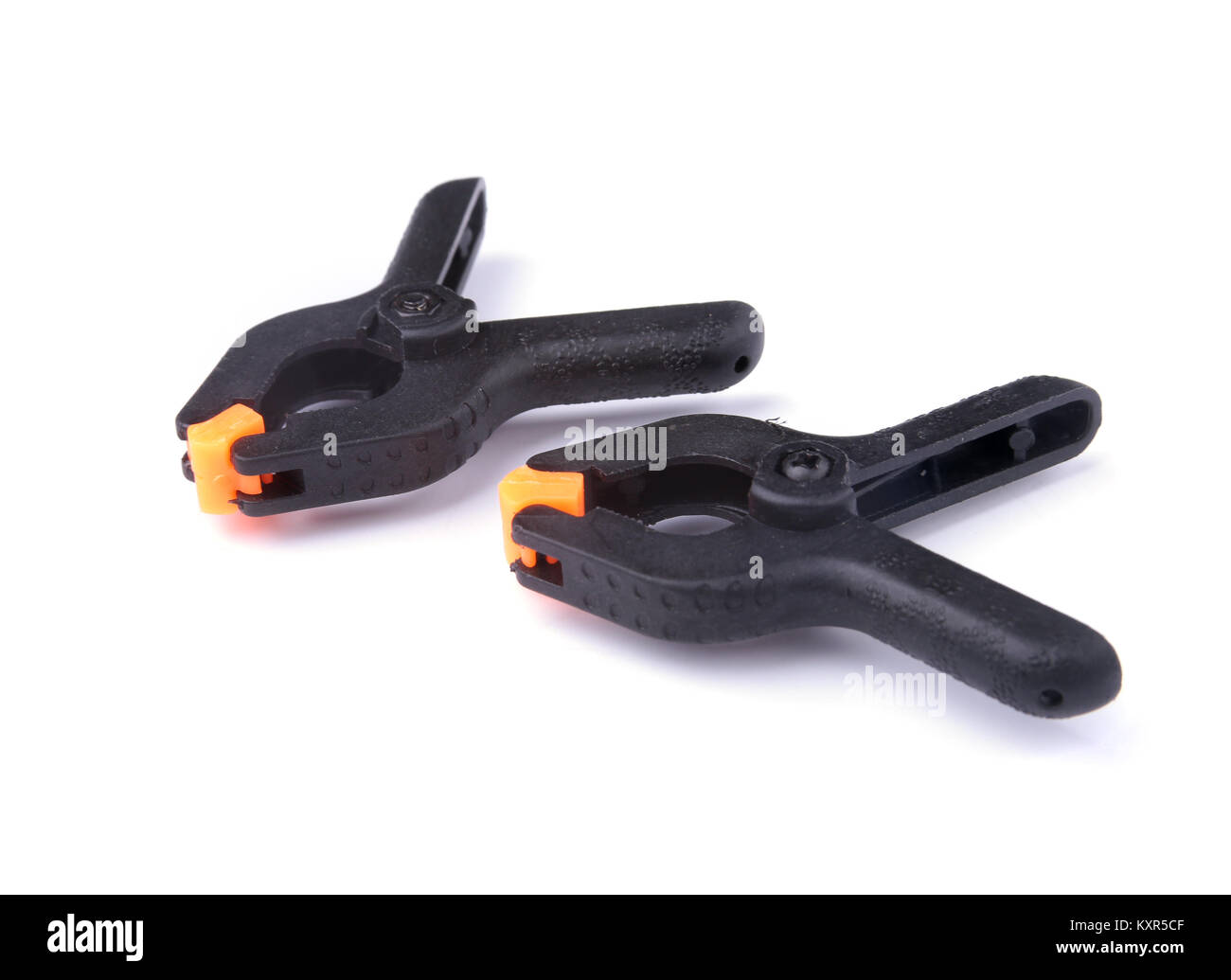 Black plastic spring clamp isolated on white background Stock Photo - Alamy