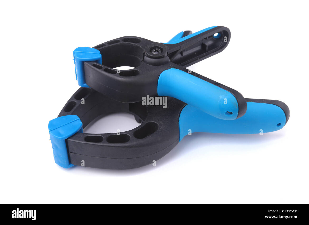 Black plastic spring clamp isolated on white background Stock Photo - Alamy