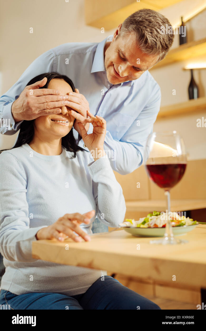 Alert man surprising his woman Stock Photo - Alamy
