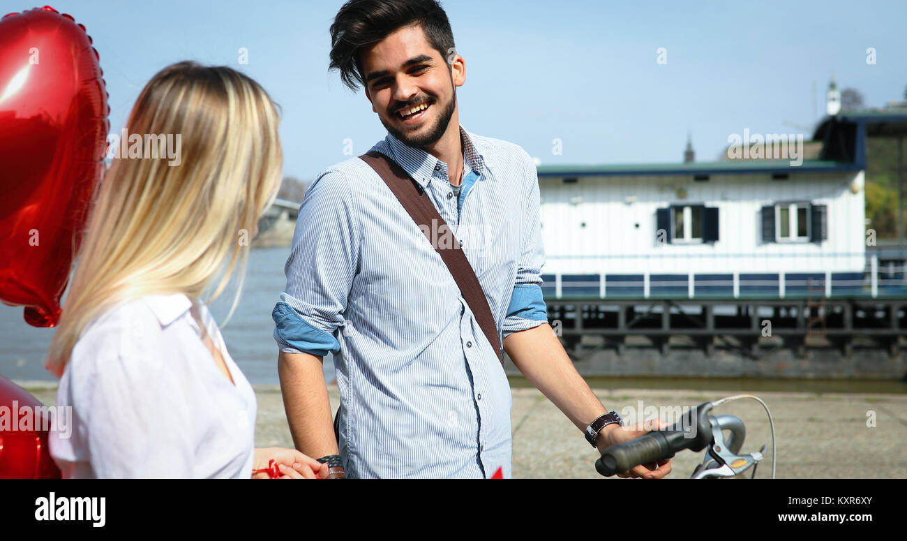 Picture of romantic couple standing outside with baloons Stock Photo ...