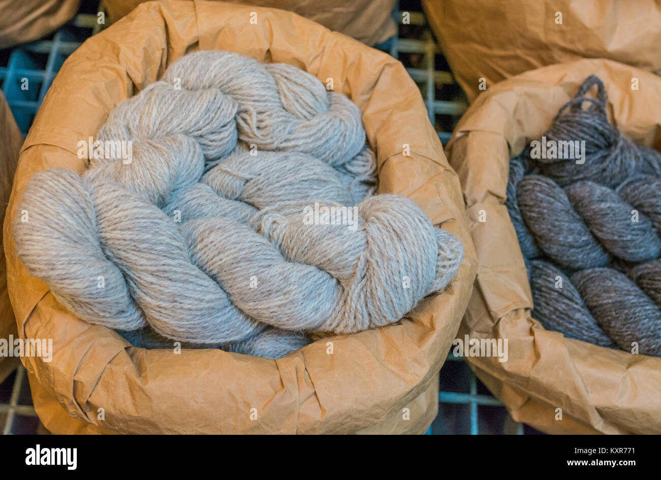 Grey wool yarn in raw paper containers. Boiled Wool Stock Photo - Alamy