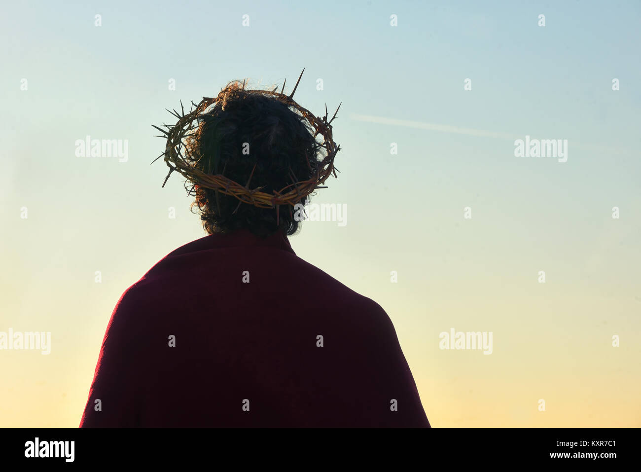 Jesus Christ with crown of thorns against the sun Stock Photo - Alamy