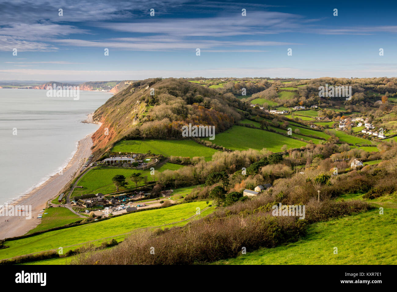 Looking west from Branscombe beach towards the red sandstone cliffs at ...