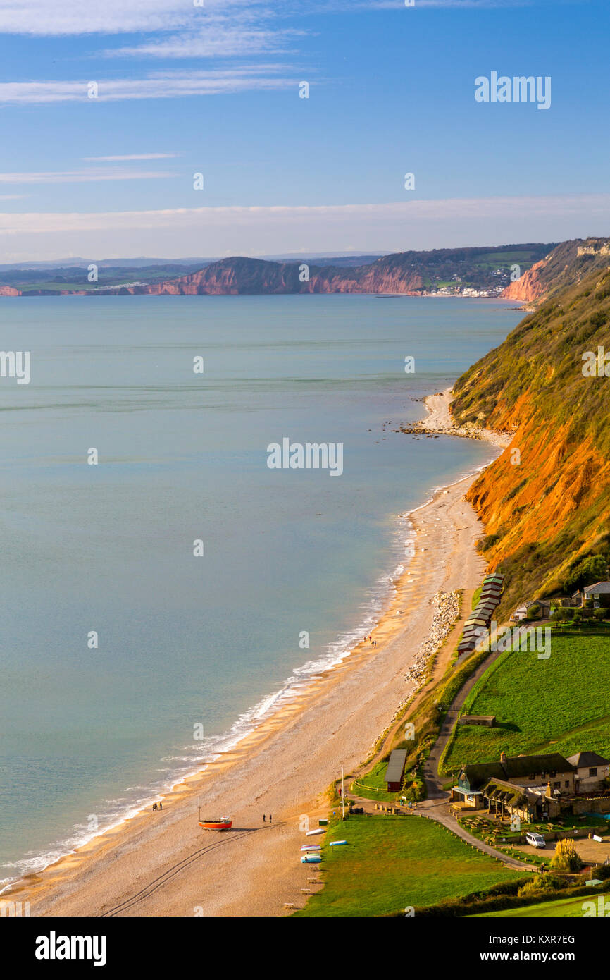Looking west from Branscombe beach towards the red sandstone cliffs at ...
