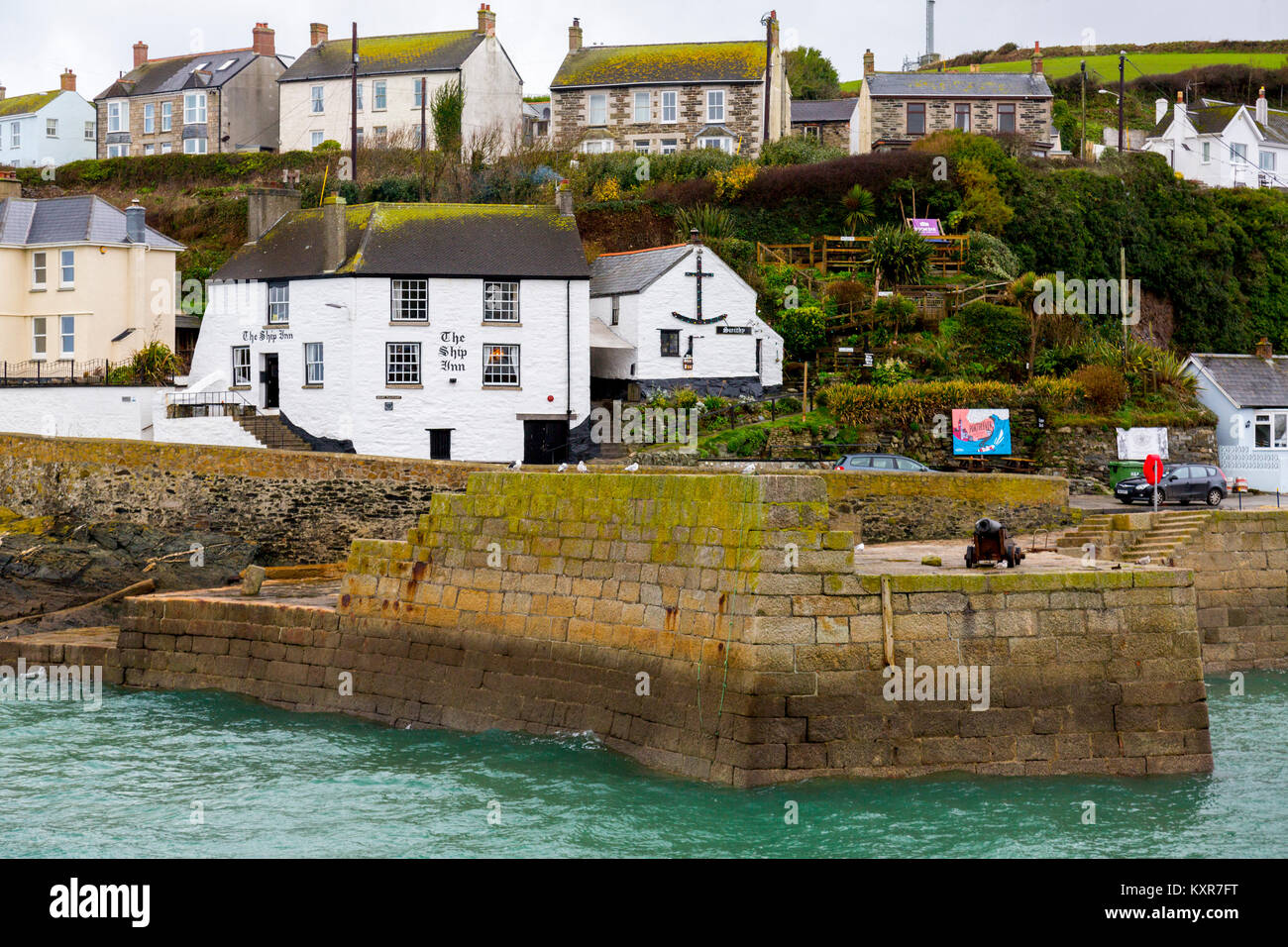 The historic Ship Inn overlooks the entrance to the harbour at ...