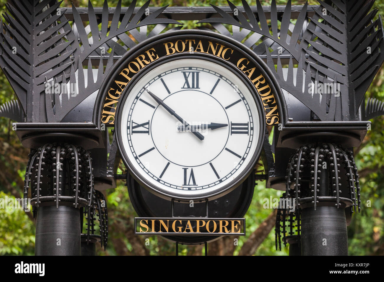 SINGAPORE - OCTOBER 17, 2014: Old Clock in The Singapore Botanic ...