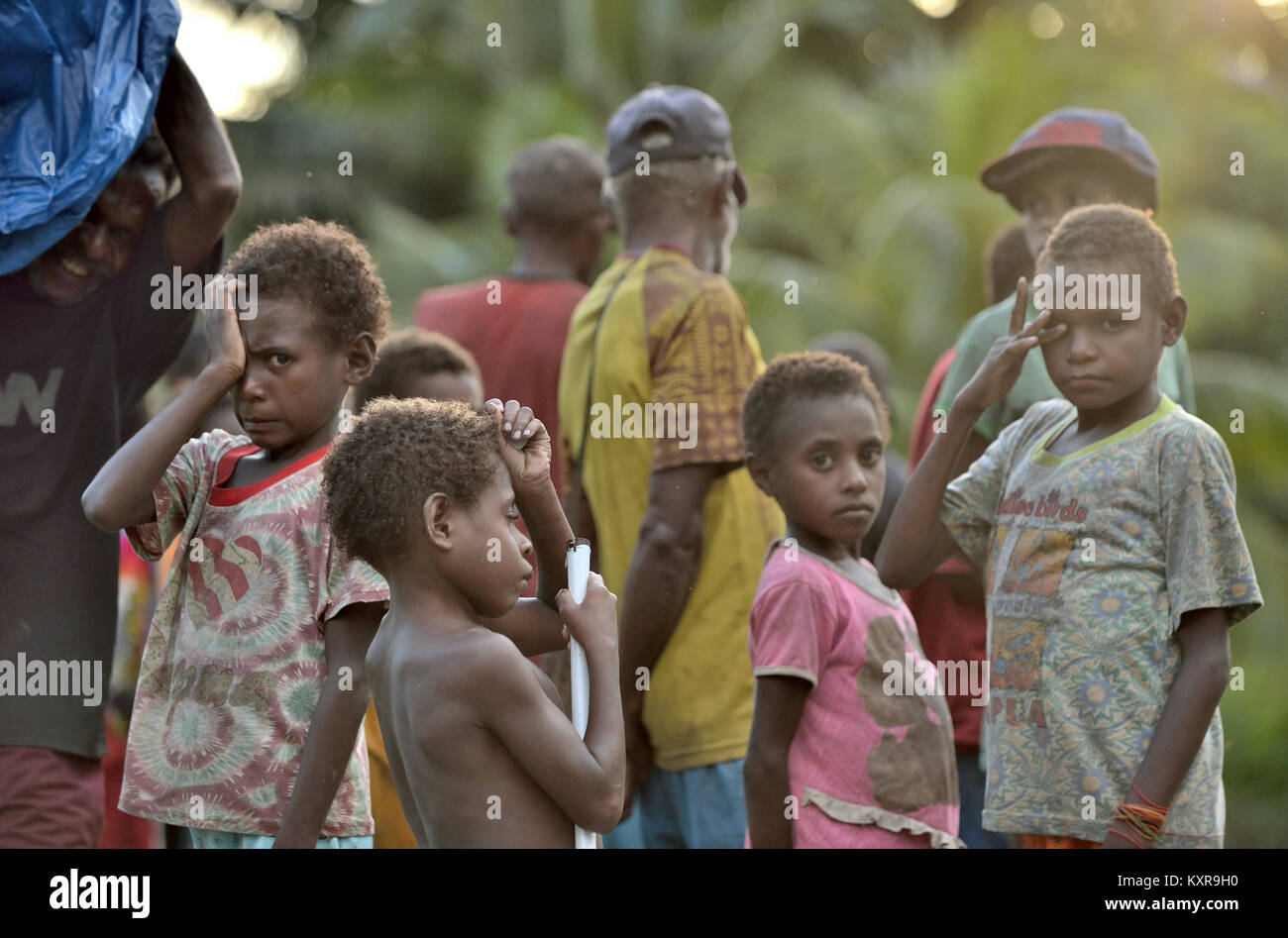 Portrait of Group of little papuan children outdoors in evening ...