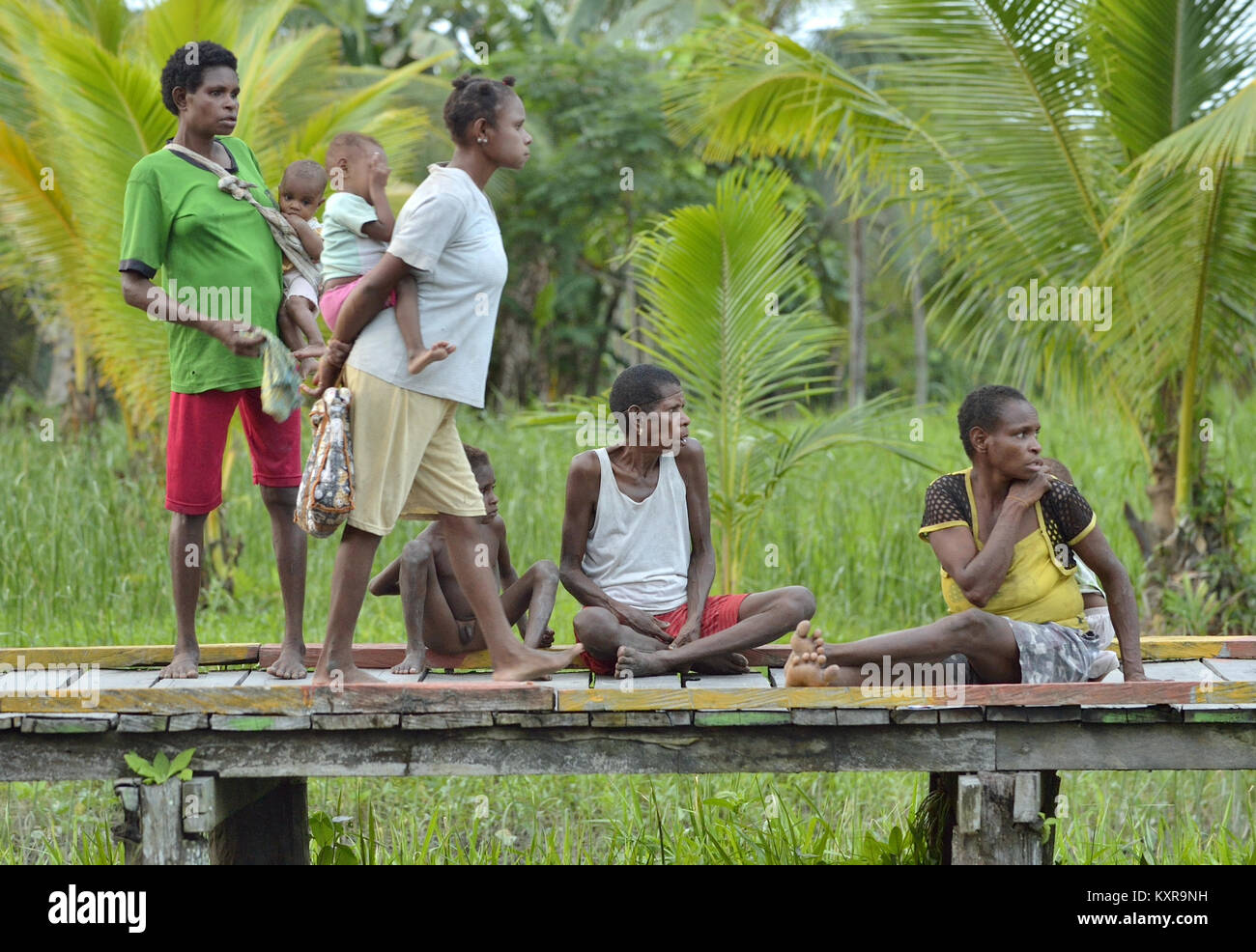 Asmat people in small deaf traditional village in jungle of New Guinea ...