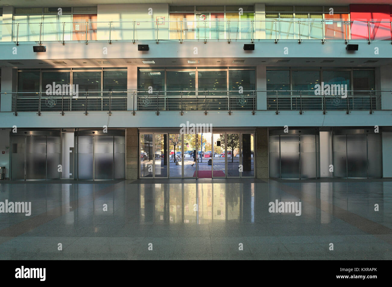 Inside view of office building with entrance and flores Stock Photo - Alamy