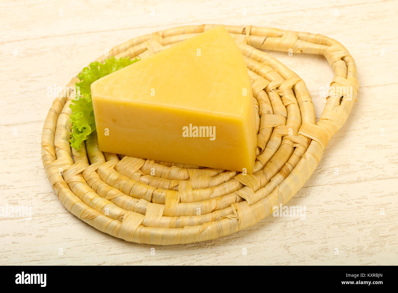 Parmesan cheese triangle Stock Photo - Alamy