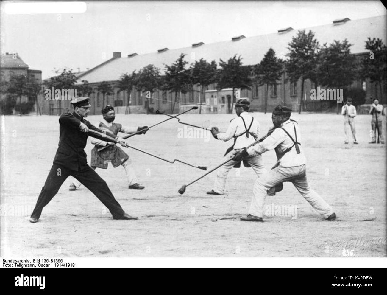 This historical image from the Bundesarchiv captures a fencing match at ...