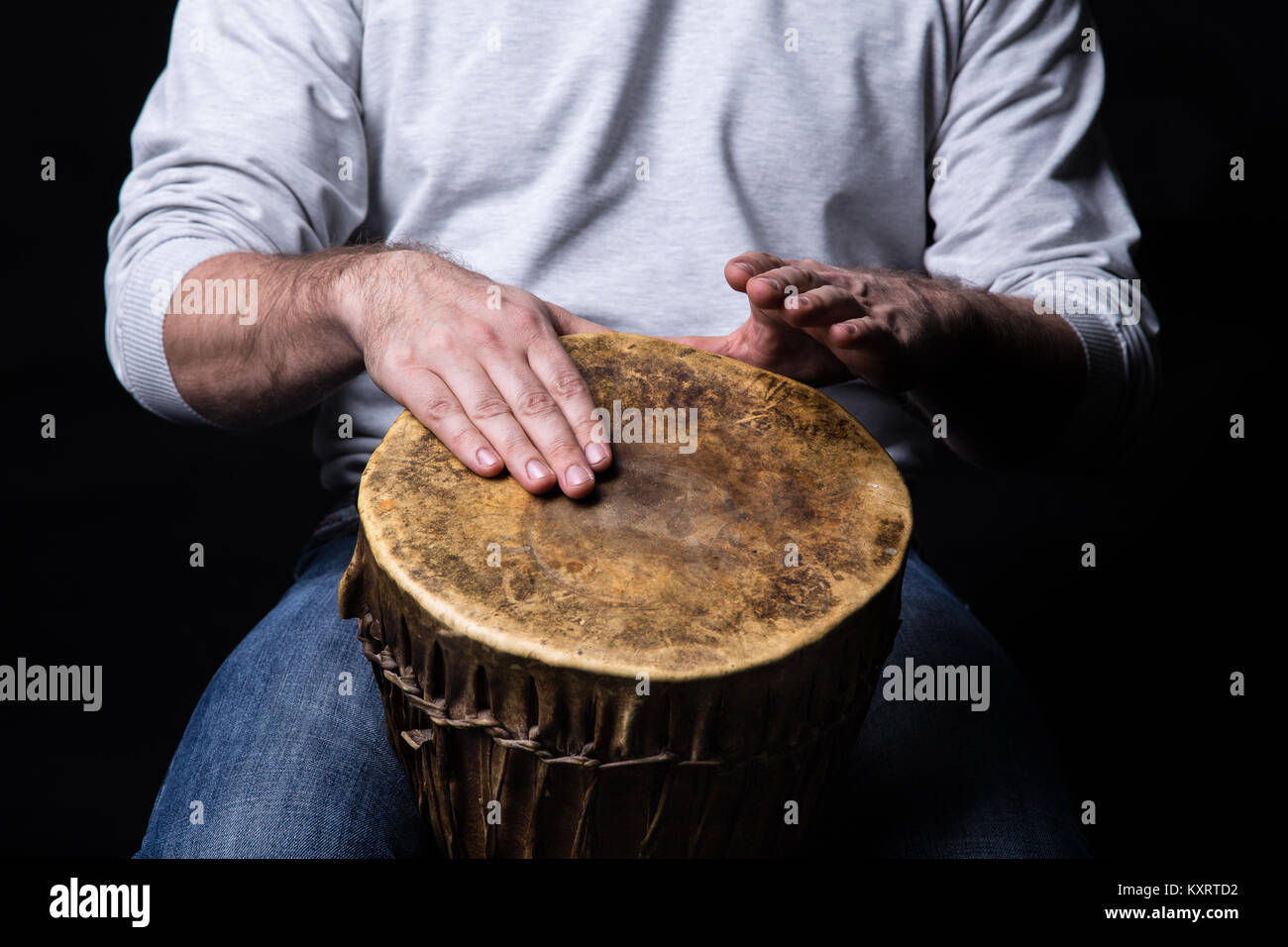 Man playing african djembe drum Stock Photo - Alamy
