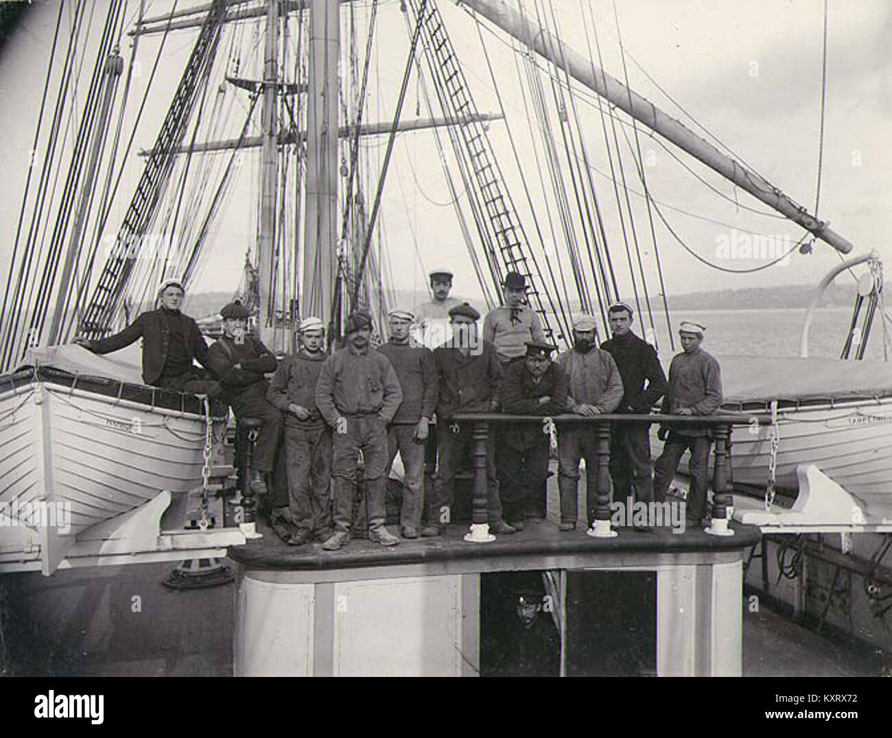 Crew standing on the wheelhouse of the three-masted German ship ...