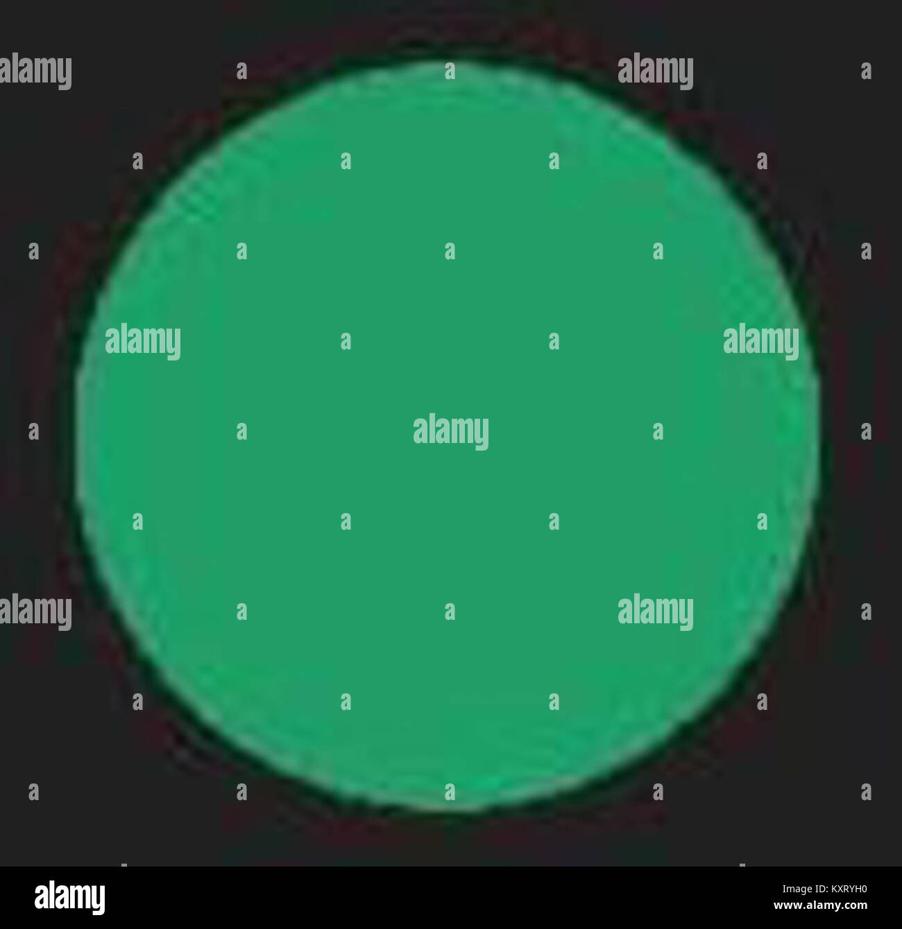 This image depicts a historical traffic signal with a green light ...