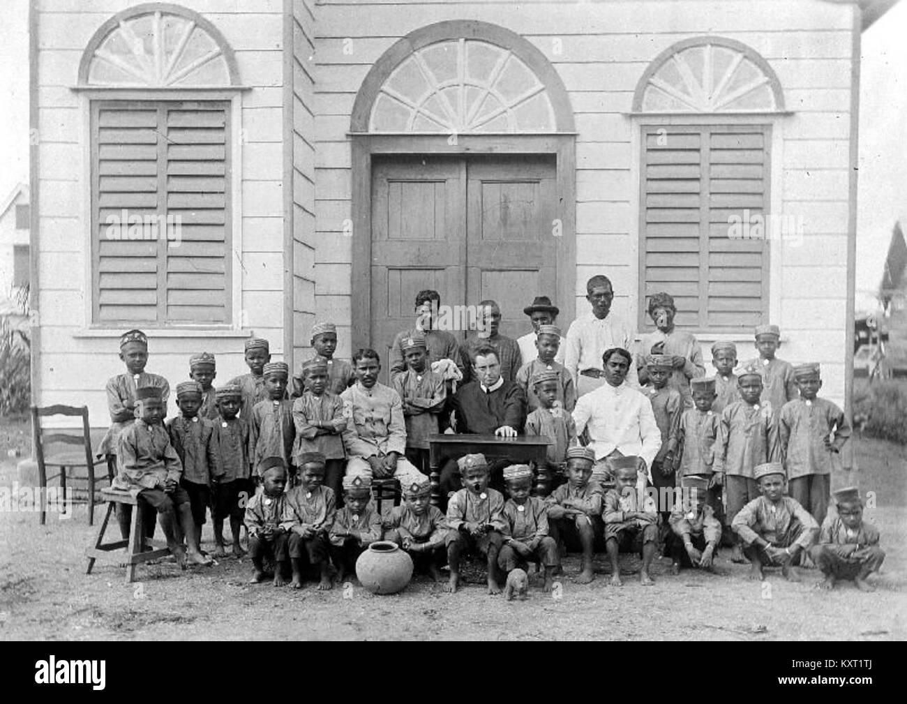 A photograph from the R.K. Mission collection showing the first fruits ...