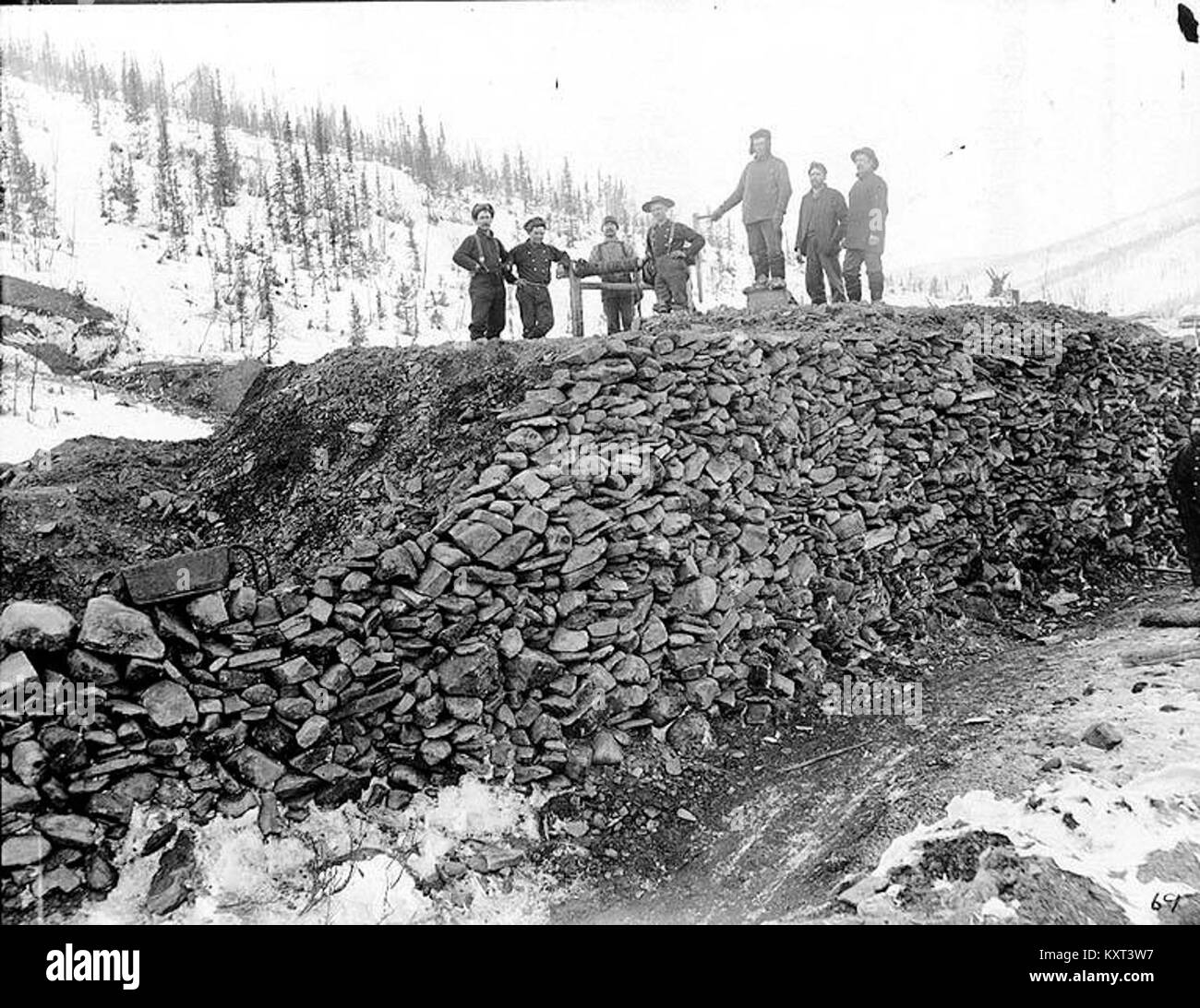 Photograph from 1899 showing eight miners working at a mining dump in ...